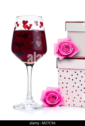 Bottle of wine, rose flower, ribbon and heart-shaped cookies on grey ...