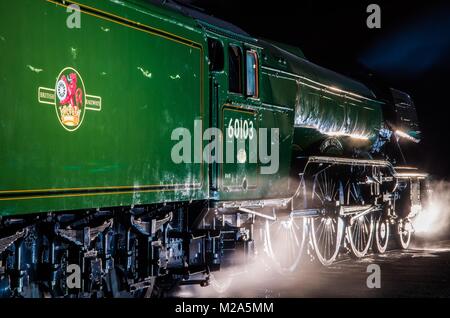 A horizontal image of the steam train parked in the town of Jasper as a ...