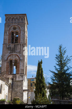 A church altar in Ravello, Italy features candles, a madonna painting ...
