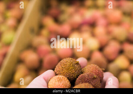lychee on the market lychee choice for cooking Stock Photo - Alamy