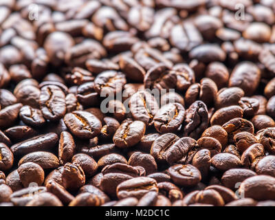 Roasted coffee beans top view, closeup image, space for text Stock ...