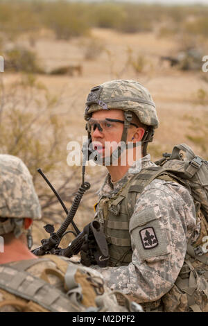 A platoon leader with 1st Battalion, 158th Infantry Regiment gives an ...