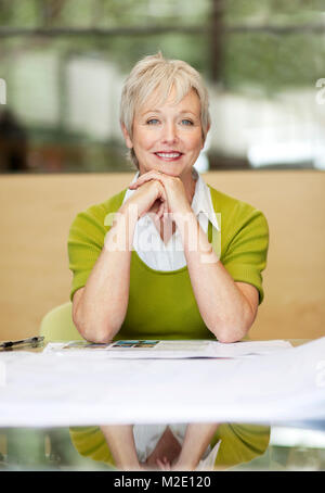 Portrait of cheerful positive glad master who is working with level in ...