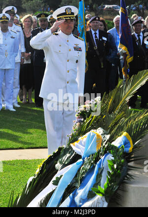 An army officer salutes during a wreath laying ceremony at The Hector ...