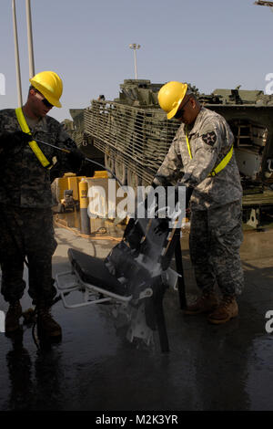 1st Armored Division Soldiers take instructions from a leader during ...
