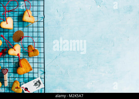 Board with tasty cookies and jam for Valentine's Day celebration on ...