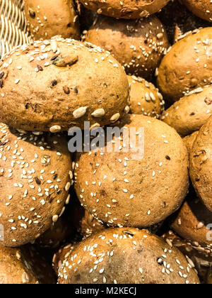 Whole-wheat rye rolls in bread basket Stock Photo - Alamy