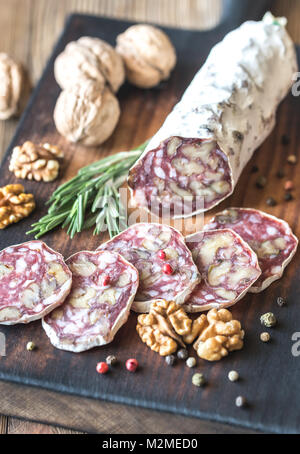 Sliced Air-dried salami with rosemary and cherry tomatoes - wood ...