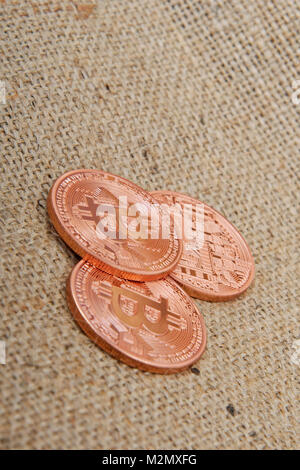Bronze Bitcoins on a brown sack cloth Stock Photo - Alamy