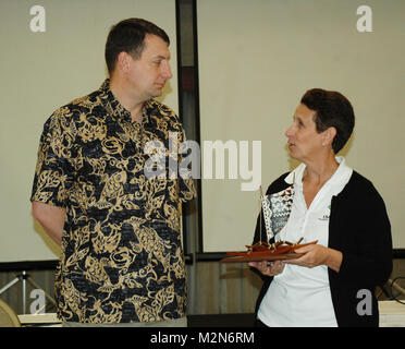 A soldier receives an award from Col. Andrew Kiser, commander of 2nd ...