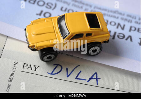 "DVLA" WRITTEN ON CHEQUE BOOK WITH MODEL CAR RE DVLA DRIVER VEHICLE ...