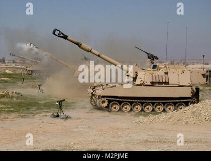 The M109A6 Paladin 155 mm Self-Propelled Howitzer (SPH) along with the M992A2 Field Artillery ...