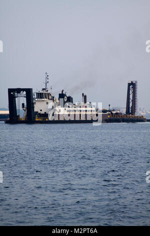 The Norfolk Dredging Company’s hydraulic dredge CHARLESTON works to ...