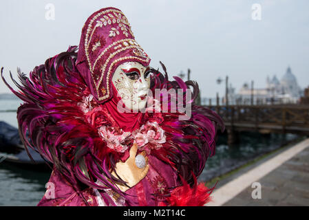 Venice, Italy 8th February, 2018. People in costumes pose by St Mark's ...