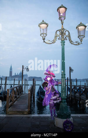 Venice, Italy 8th February, 2018. People in costumes pose by St Mark's ...