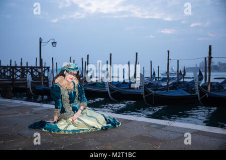 Venice, Italy 8th February, 2018. People in costumes pose in the ...