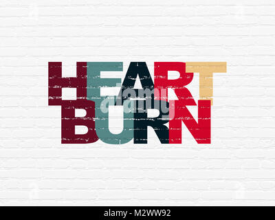Healthcare concept: Heartburn on wall background Stock Photo - Alamy