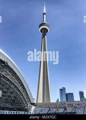 Low angle view of CN Tower between skyscrapers, Toronto, Canada Stock ...