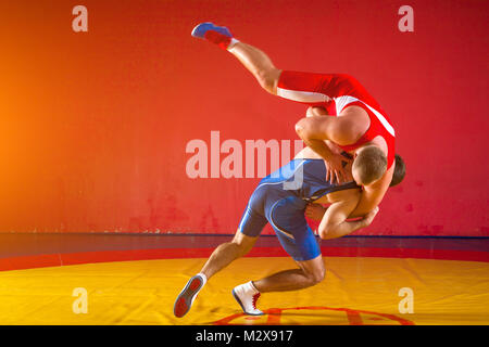 Top view. Wrestlers in action, two male athletes wrestling, training ...