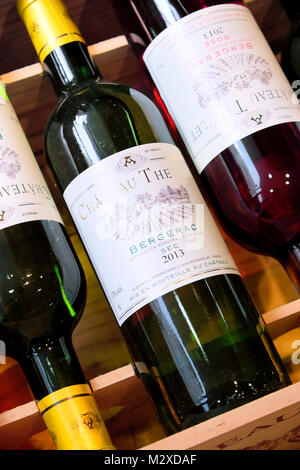 Box with bottles of wine on wooden background, closeup Stock Photo - Alamy