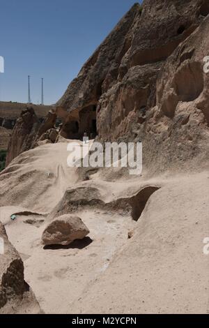 Tourists visiting some of the famous Fairy chimneys in Cappadocia which ...