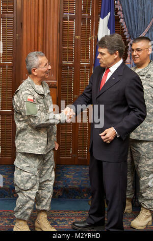 Texas Governor Rick Perry presents the badges to the Governor's Twenty ...