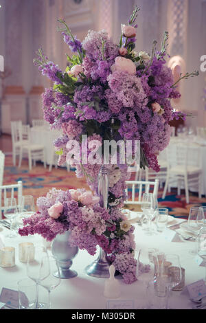 Spring table setting with beautiful lilac flowers on grey concrete ...