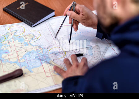 Navigation in the chart room on a sailing yacht Stock Photo - Alamy