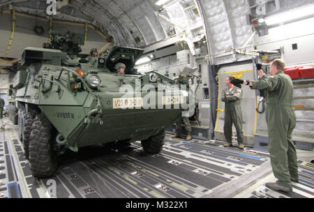 Strykers are loaded into aircraft at Fort Wainwright, Alaska’s Ladd ...
