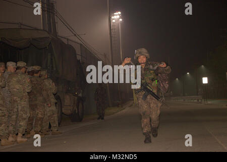 A Republic of Korea Army (ROKA) soldier reviews battle plans near his ...