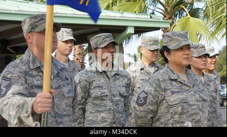 Members of the 154th Wing Comptroller Flight offer the opening salute ...