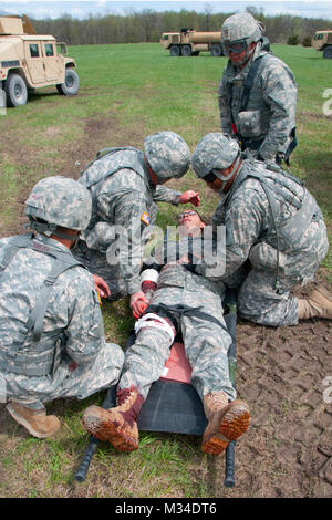 A Soldier from Company A, 700th Brigade Support Battalion, administers ...