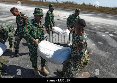 Falintil-Forcas de Defesa de Timor Leste Pvt. Pedro Lopes, right ...