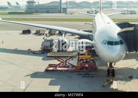 Preparation before flight. Loading of cargo container against airplane ...