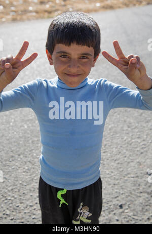 A young Kurdish boy poses for a Stock Photo - Alamy
