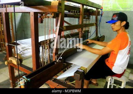 Traditional silk factory. Silk spinning machine at work. Dalat Stock ...