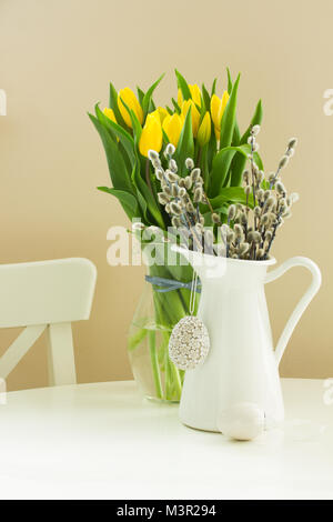 Easter table decorations with eggs, catkins and ceramic figurines ...