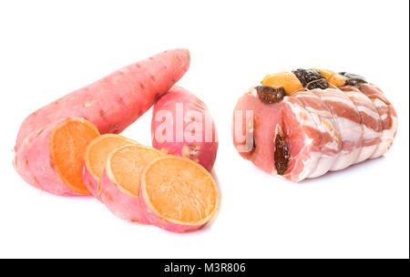 pork joint with fruit in front of white background Stock Photo - Alamy