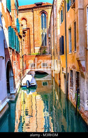 Colorful Small Boats and Side Canal with Reflections in Venice Italy Stock Photo - Alamy