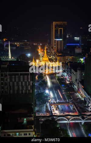 Downtown, Sule Pagoda Road and lit Sule Pagoda in Yangon, Myanmar ...