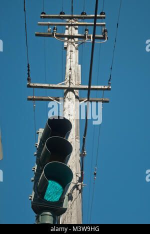 Electricity pylon with street light Stock Photo - Alamy