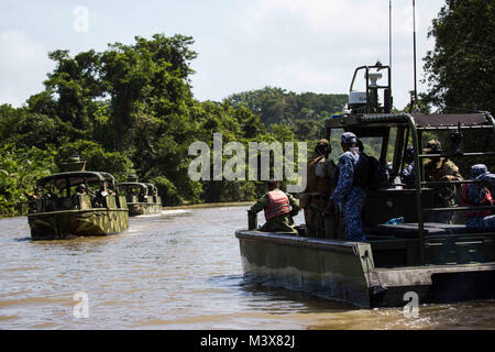 A Belize Defense Force Special Boat Unit commando conducts insertion ...