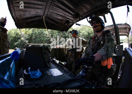 A Belize Defense Force Special Boat Unit commando conducts insertion ...
