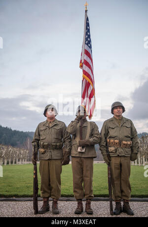 EPINAL, France (Feb. 3, 2018) Military and civilian volunteers fold the ...