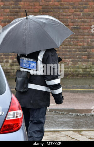 Civil Enforcement Office / Traffic warden writing in his notebook ...