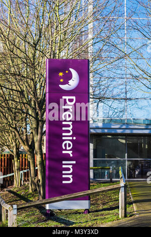 Premier Inn sign with company name and logo on the exterior of one of ...
