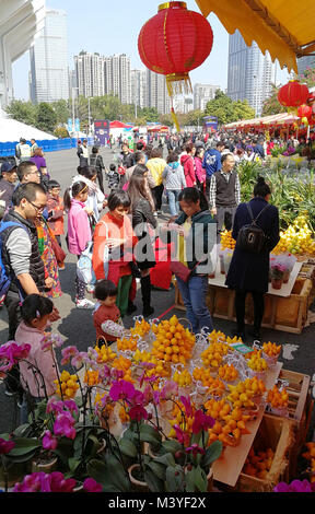 People select Spring Festival flowers at a market in Rizhao City, east ...