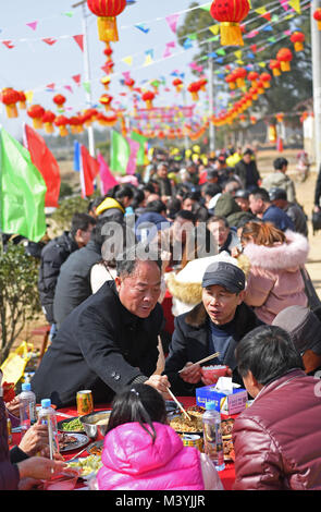 Yichun, China's Jiangxi Province. 13th Feb, 2018. Villagers gather ...