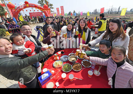 Yichun, China's Jiangxi Province. 13th Feb, 2018. Villagers gather ...