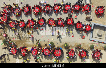 Yichun, China's Jiangxi Province. 13th Feb, 2018. Villagers gather ...